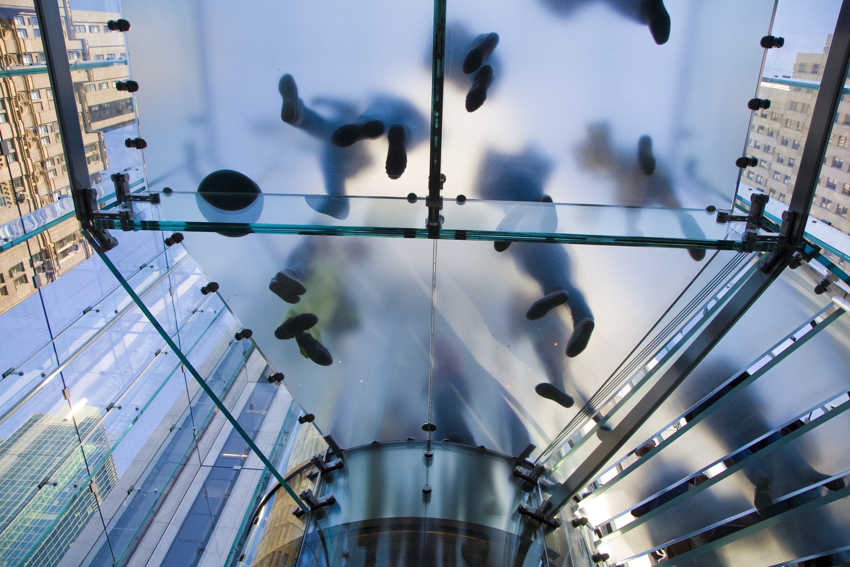 People walking across a walkway in a building in New York - New ...